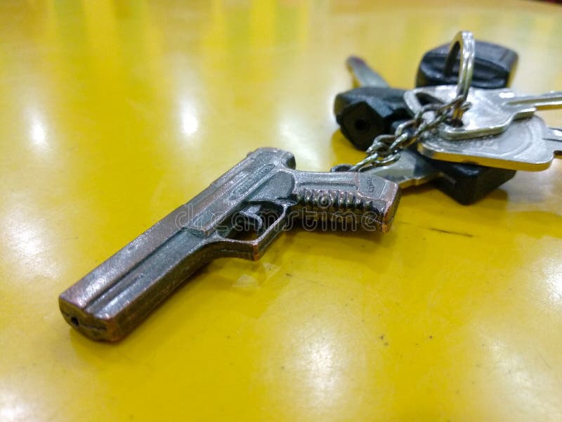 Key Chain on the Yellow Table Stock Photo - Image of yellow, table ...