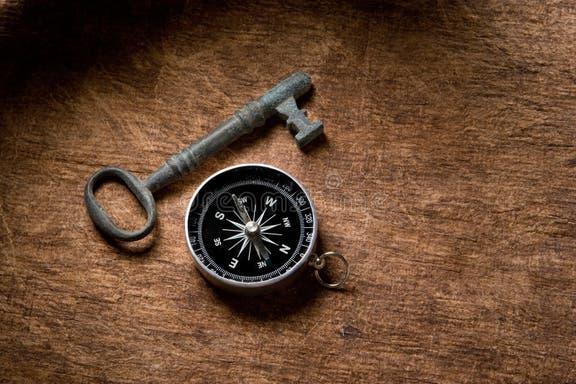 Key and compass stock photo. Image of longitude, discovery - 13942832