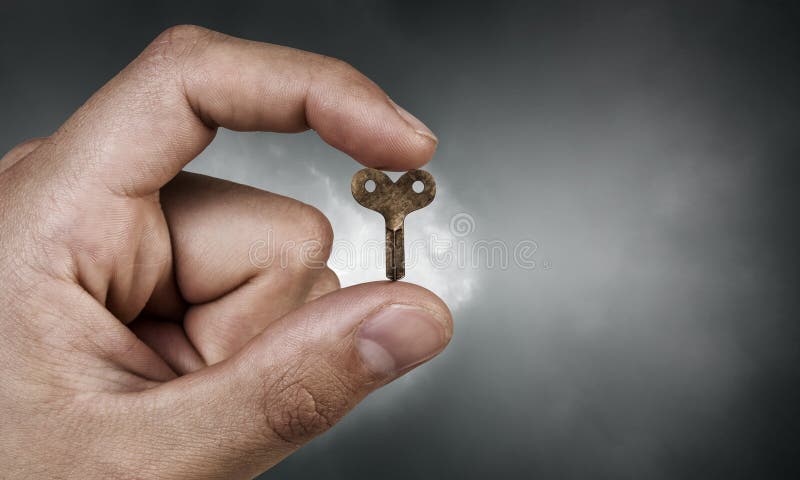 Key between fingers stock image. Image of purchase, tiny - 72391067