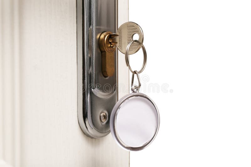 Key with Fob in Door Lock, Closeup. Space for Text Stock Image - Image ...