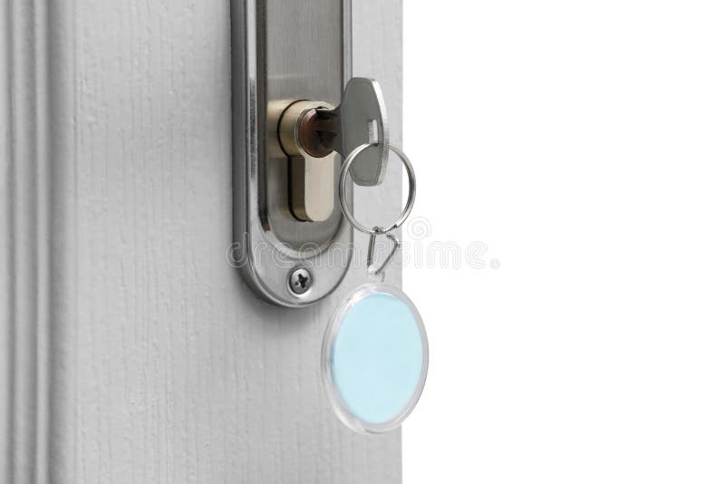 Key with Fob in Door Lock, Closeup. Space for Text Stock Image - Image ...