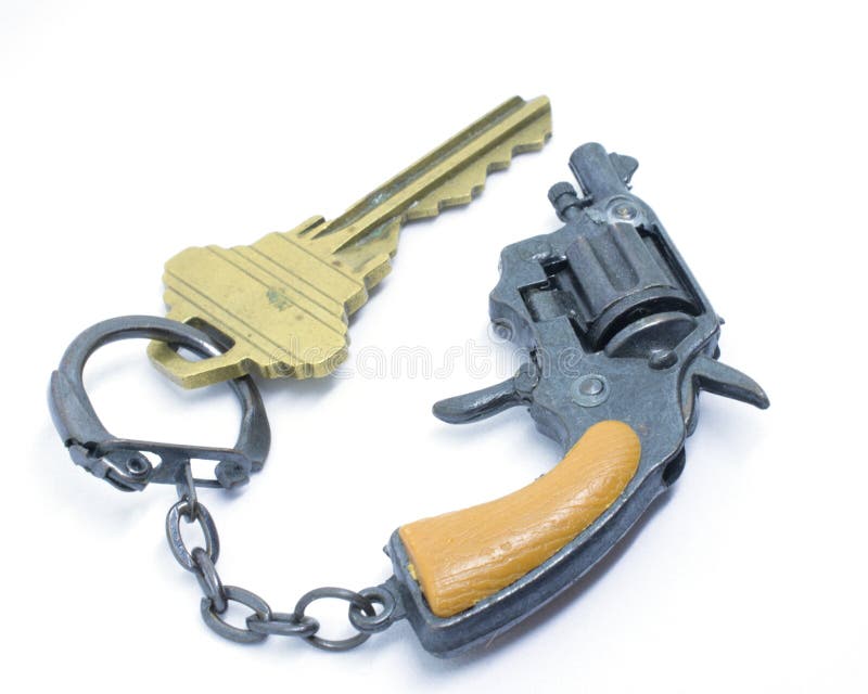 Key on a gun key-chain stock photo. Image of firearm - 99562074
