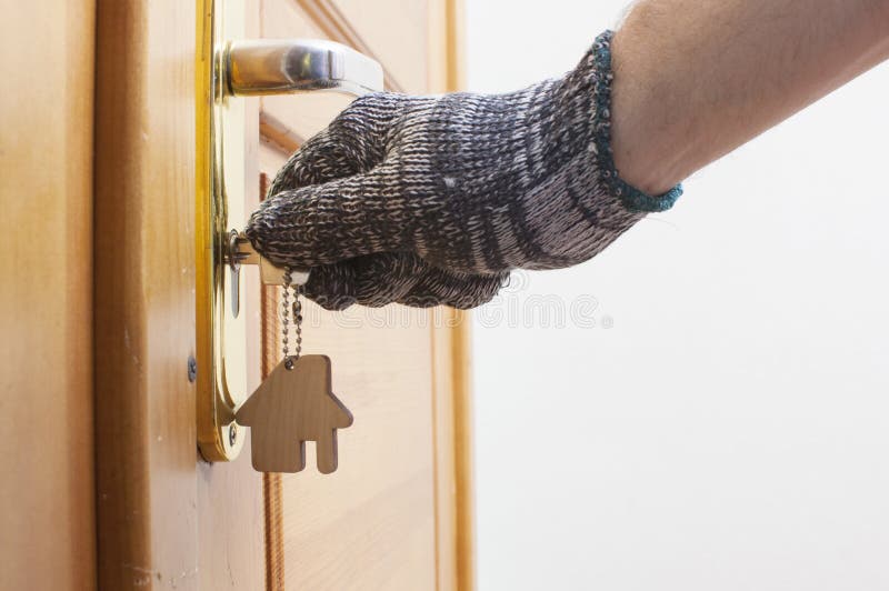 Hand with chrome house key stock image. Image of mortgage - 26519501