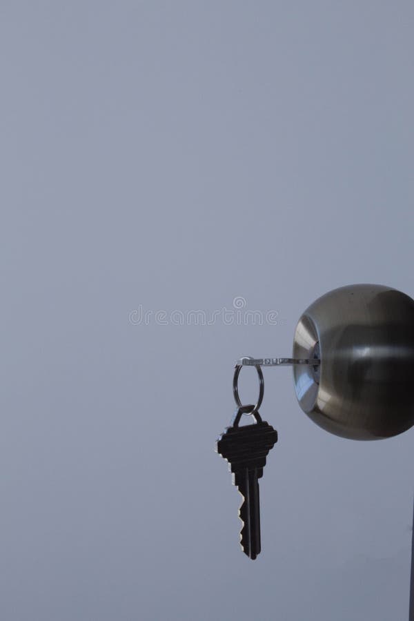 Key hanging from its lock stock photo. Image of safety - 139214398