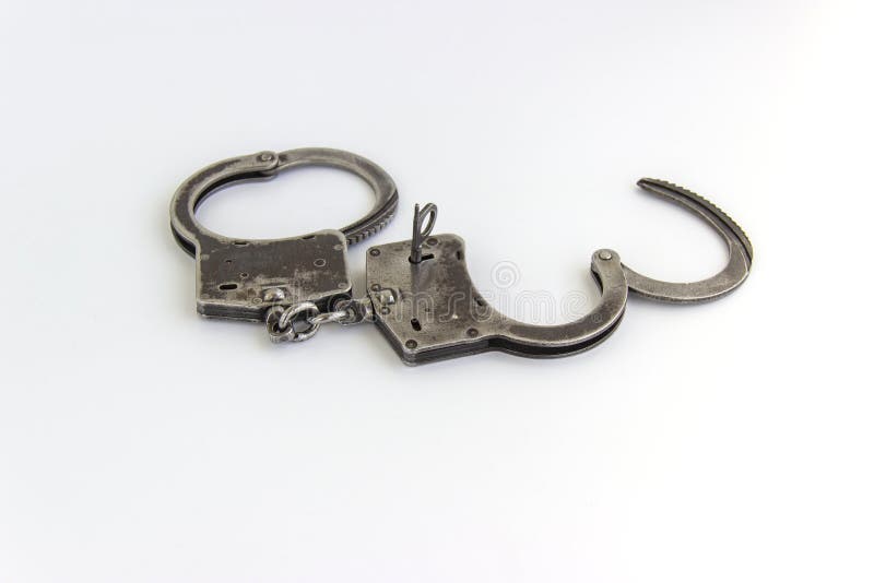 The Key of the House in Handcuffs, Isolated on White Background Stock ...