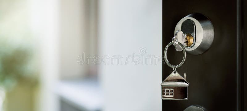 Key with House Keychain in the Lock of the Door. Copy Space Stock Image ...