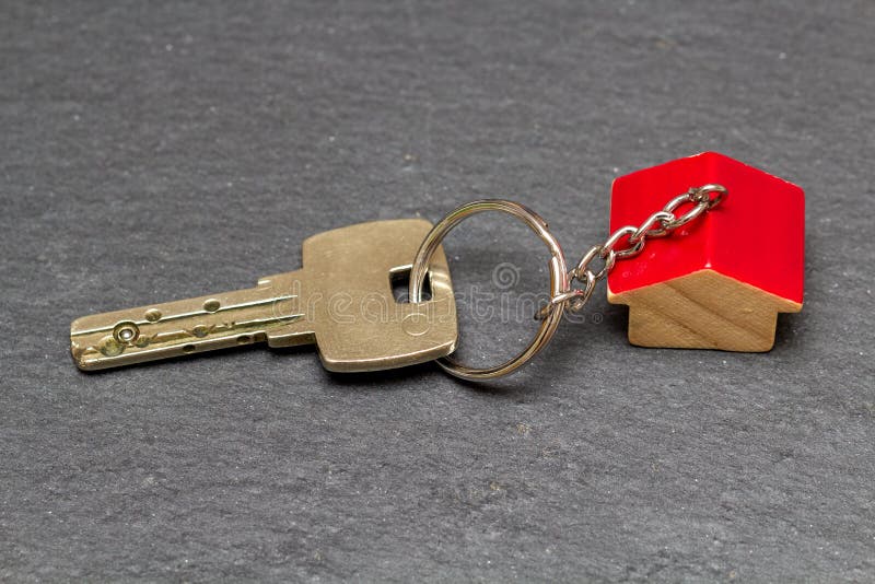 Key with House Shaped Key Chain on Slate Stock Image - Image of safe ...