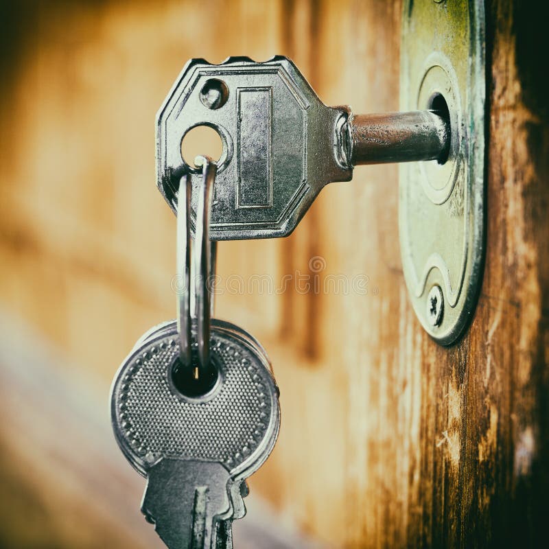 Key inserted in a key hole stock photo. Image of entrance - 150507808