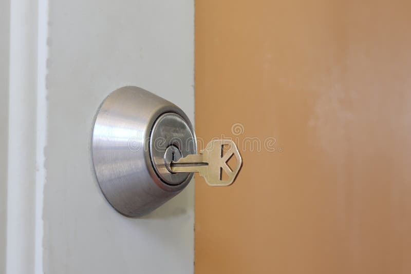 A Key Inserted into a Lock. Stock Image - Image of metal, keyhole ...