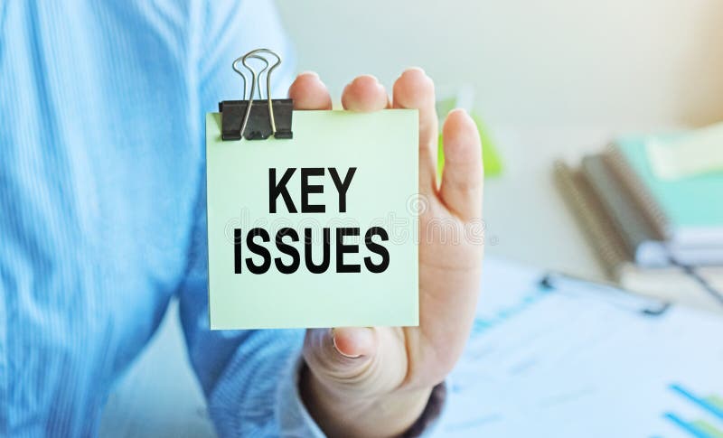 KEY ISSUES Written on a Voucher Shown by a Female Businessman. Soft ...