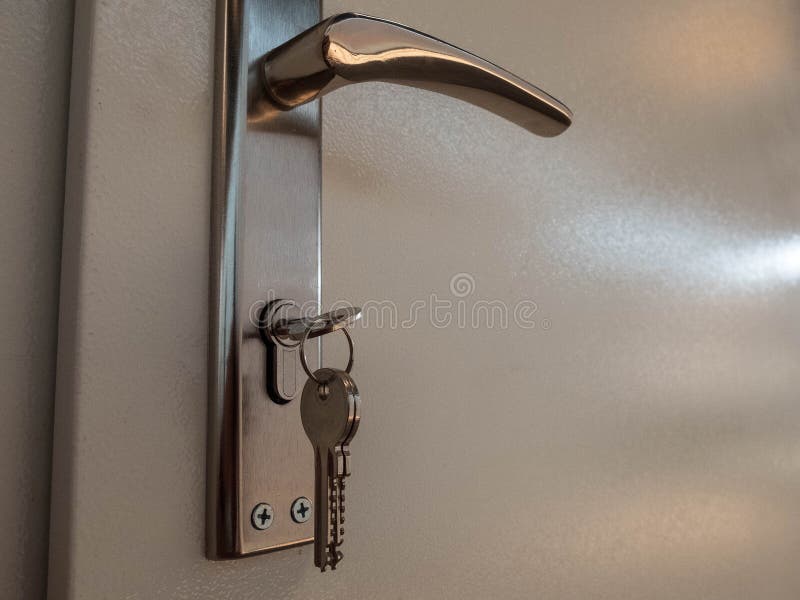Key on the Key Chain Inside the Door Keyhole Stock Photo - Image of ...