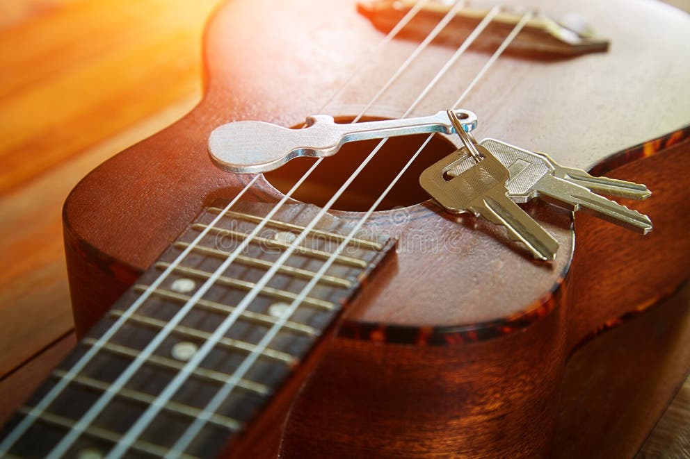 Key with Keychain in Form of Guitar Stock Image - Image of closeup ...