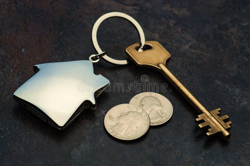 Key and Keychain in the Shape of a House Laying on Marble Background ...
