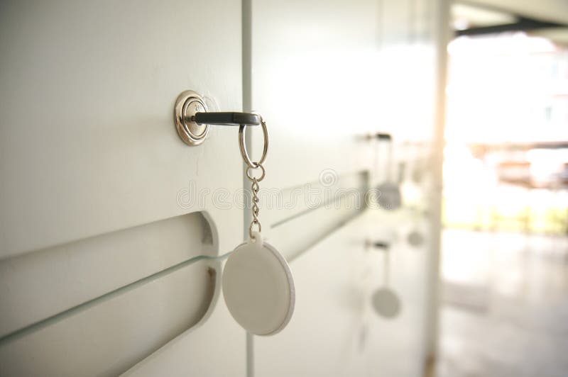 Key in Keyhole on Locker Door. Keys Stuck in a Lock Stock Image - Image ...