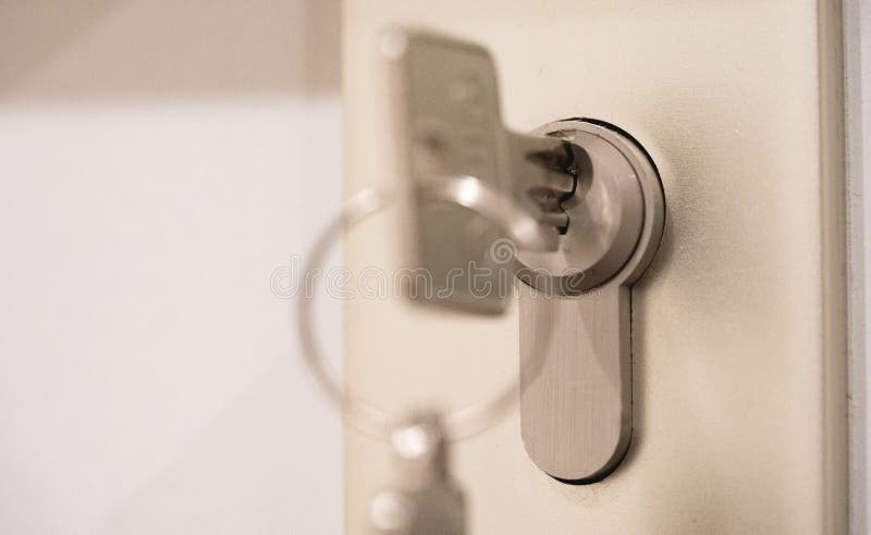 Key in lock of front door stock photo. Image of front - 262180974