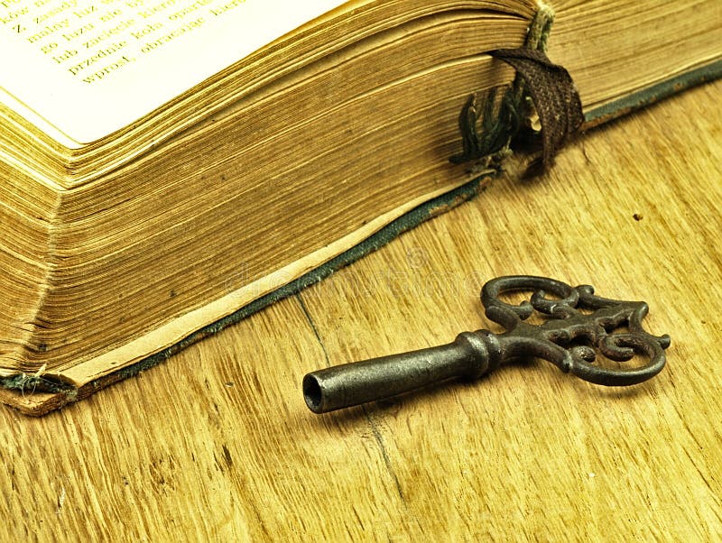 Key and Old, Open Book with a Damaged Cover. Stock Image - Image of ...