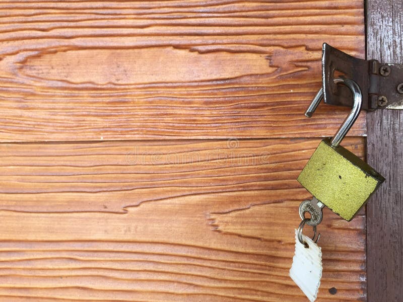 A Key Open a Lock on a Wooden Door Stock Photo - Image of security ...
