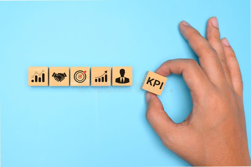 Key Performance Indicator Businessman Holding Wooden Cube With Kpi