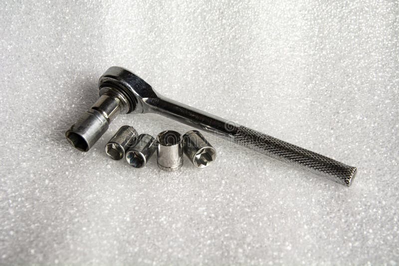 The Key is a Ratchet with Heads. Stock Image - Image of bright, black ...