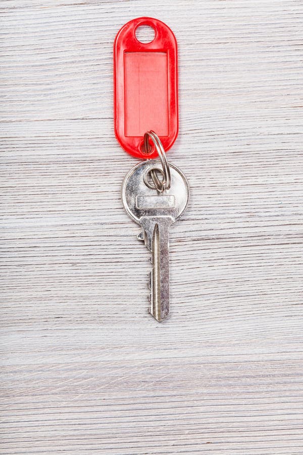 Key with Red Blank Keychain on Wood Table Stock Photo - Image of ...