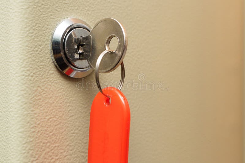 Key with a Red Tag Inserted Stock Image - Image of metal, entrance ...