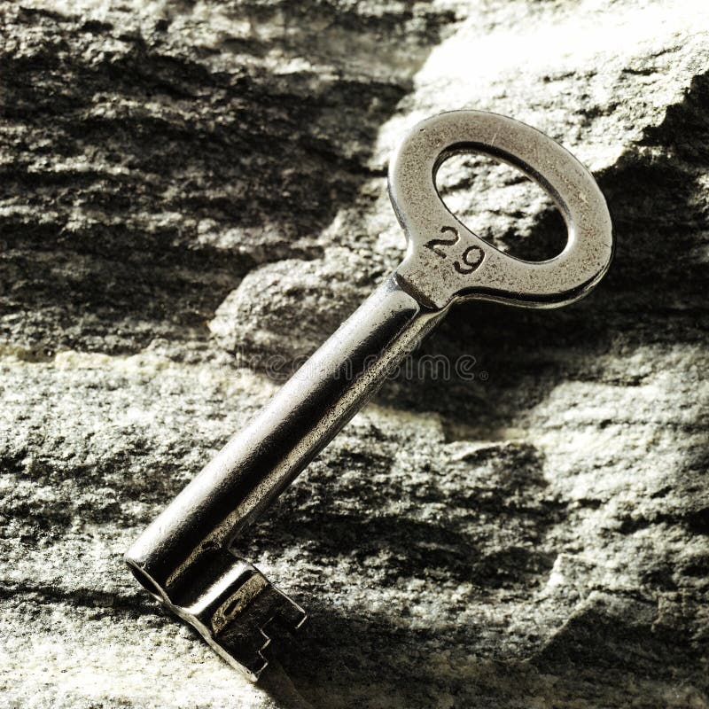 Key on the rocks stock photo. Image of silver, aged, stone - 21617394