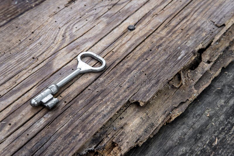 Key on a Rustic Wooden Background Stock Photo - Image of confidential ...