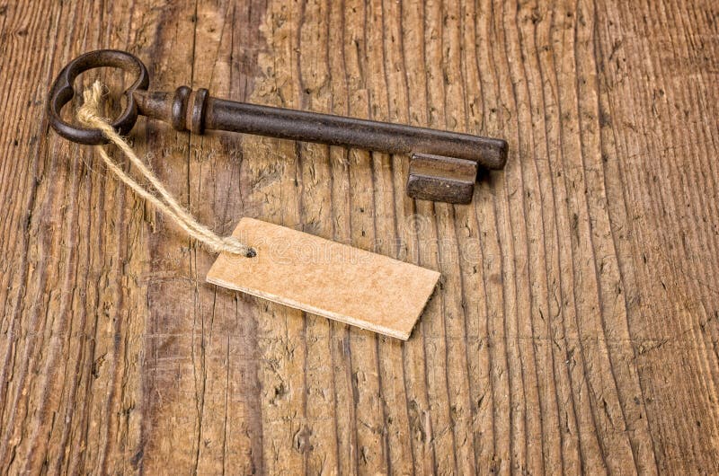 Key with a Tag on a Wooden Board Stock Image - Image of cord, open ...