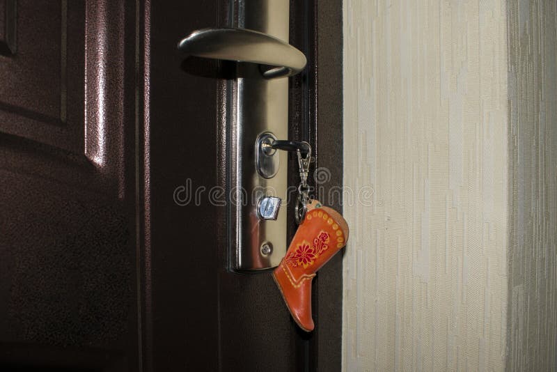 The Key with Thumb in the Form of a Boot in the Keyhole Stock Image ...