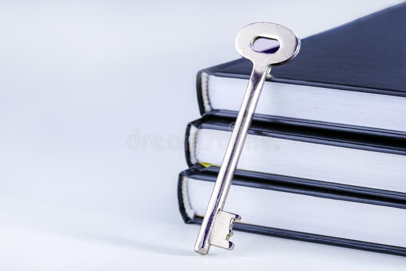 Key To Knowledge. Knowledge Concept with Books and Key with Copy Space ...