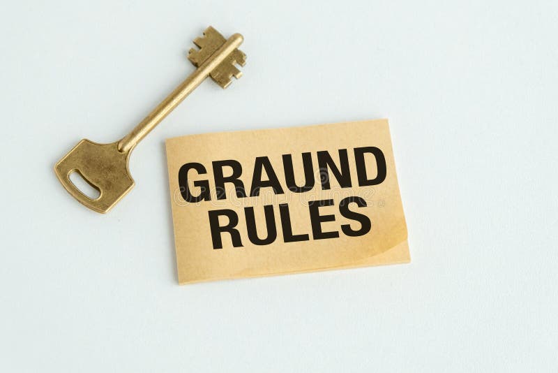 A Key is on Top of a Piece of Paper that Says Ground Rules Stock Photo ...