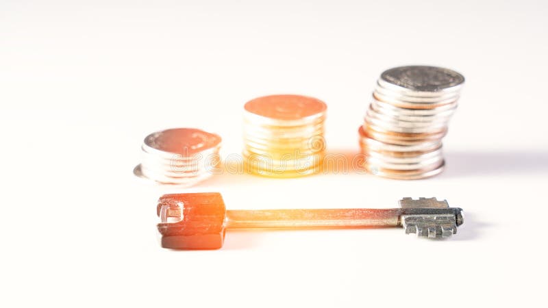 A Key is on Top of a Pile of Coins Stock Image - Image of coin, success ...