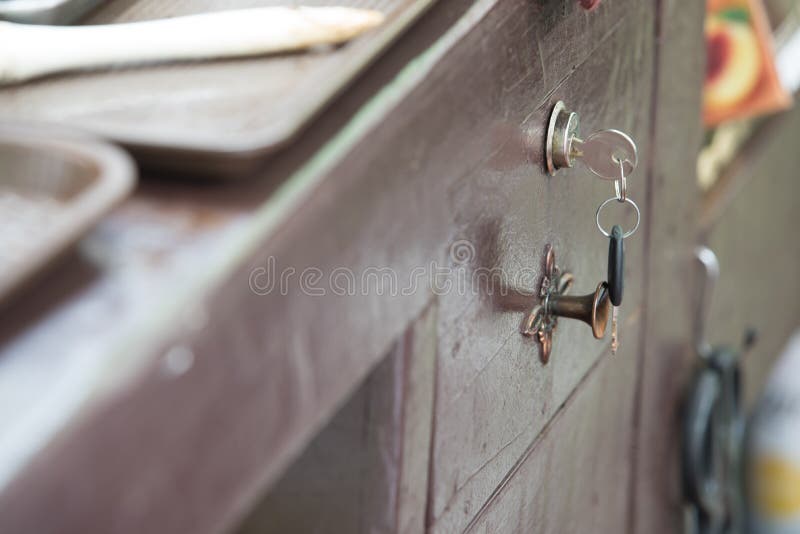Key in wood drawer stock photo. Image of property, lock - 60997850