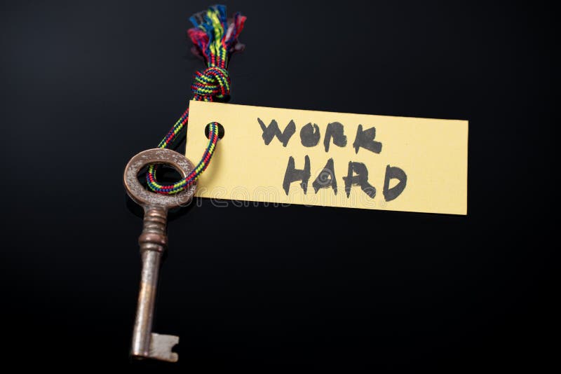 Key with WORK HARD Written on Paper Stock Image - Image of ...
