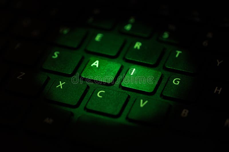 Keyboard Being Illuminated with Green Light Highlighting Letters a I ...