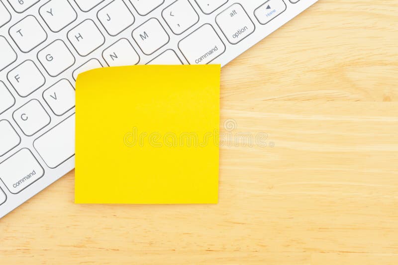 Keyboard with a Blank Sticky Note on a Desk Stock Photo - Image of ...