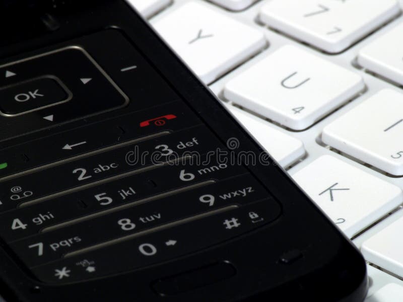 Keyboard with cell phone stock image. Image of business - 4315981