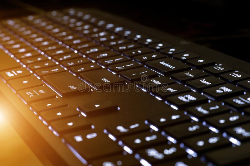 Keyboard Close-up with Backlight on a Black Background. Fragment with ...