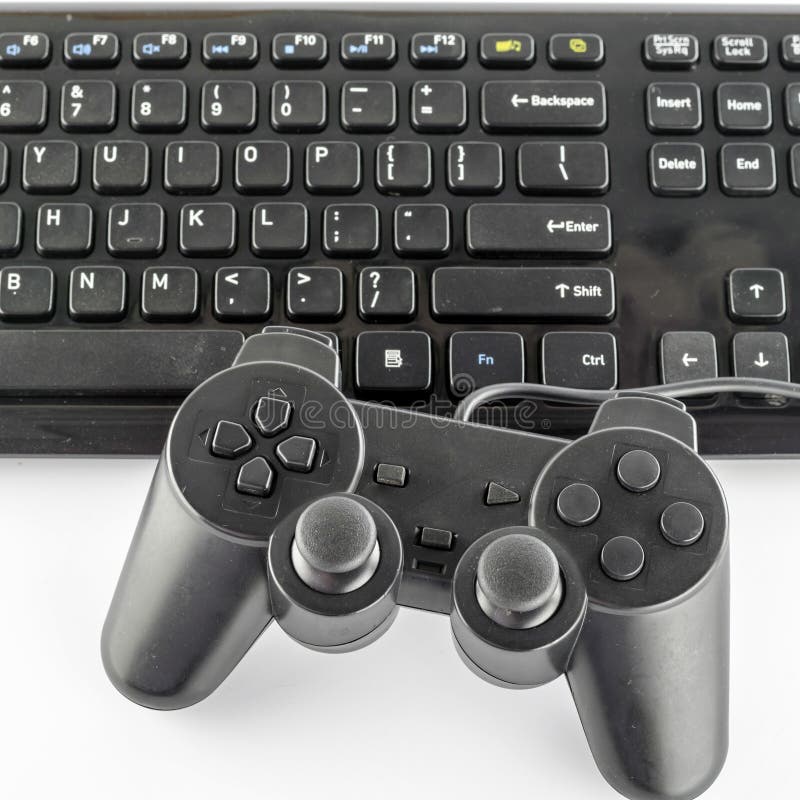 A Man Holds a Game Pad Around a Gaming Keyboard in His Hands, a Game ...