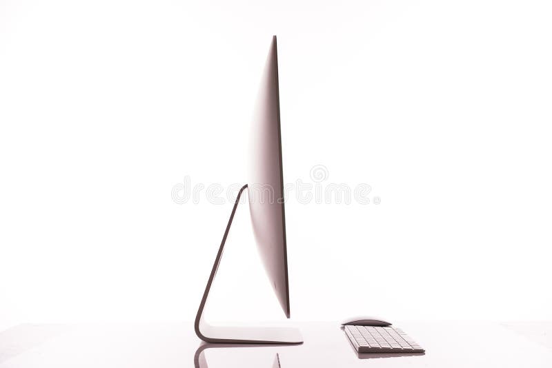 Keyboard and Computer Screen on a White Table with Reflection on White ...