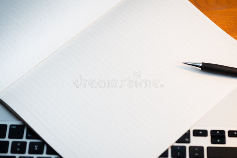 Keyboard of a Laptop from Above with a Notepad and a Pen Stock Photo ...