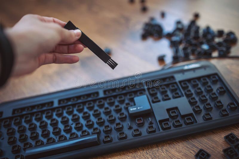 Keyboard Maintenance Process Taking Place with a Keycap Puller and ...