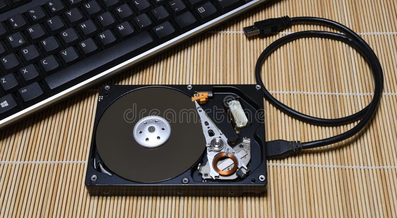 Keyboard and Open Hard Disk Drive on Wood Background Editorial Photo ...