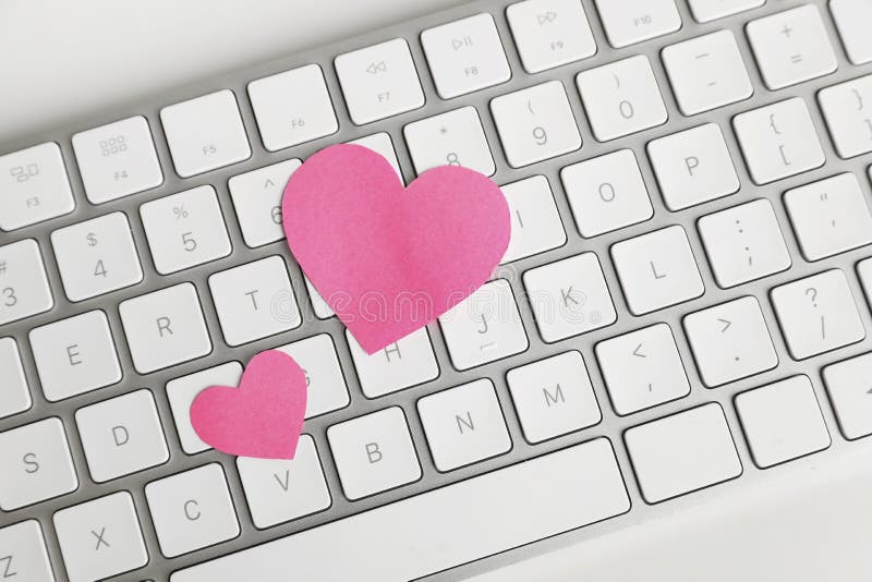 Keyboard with Pink Hearts on White Table, Top View. Valentine`s Day ...