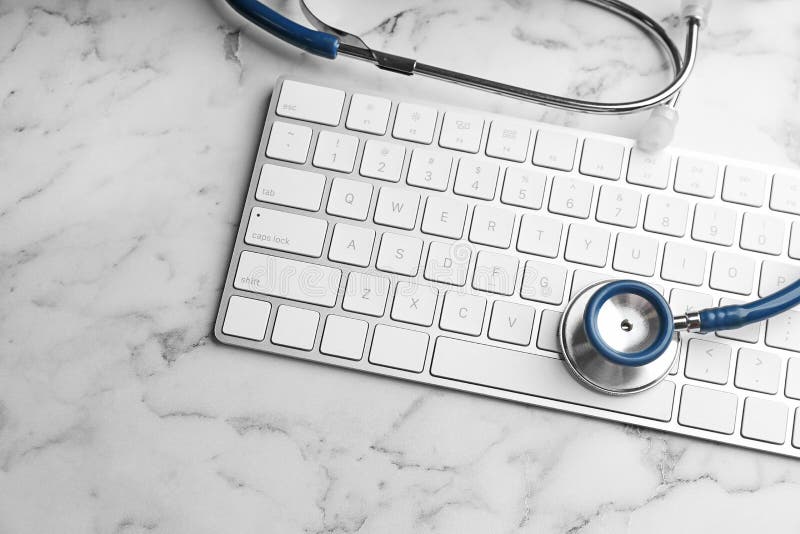 Keyboard and Stethoscope on White Marble Table. Concept of Technical ...