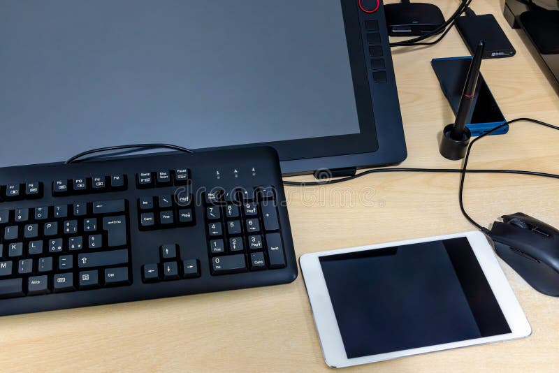 Keyboard, Tablet and Graphics Tablet on Desk Stock Photo - Image of ...