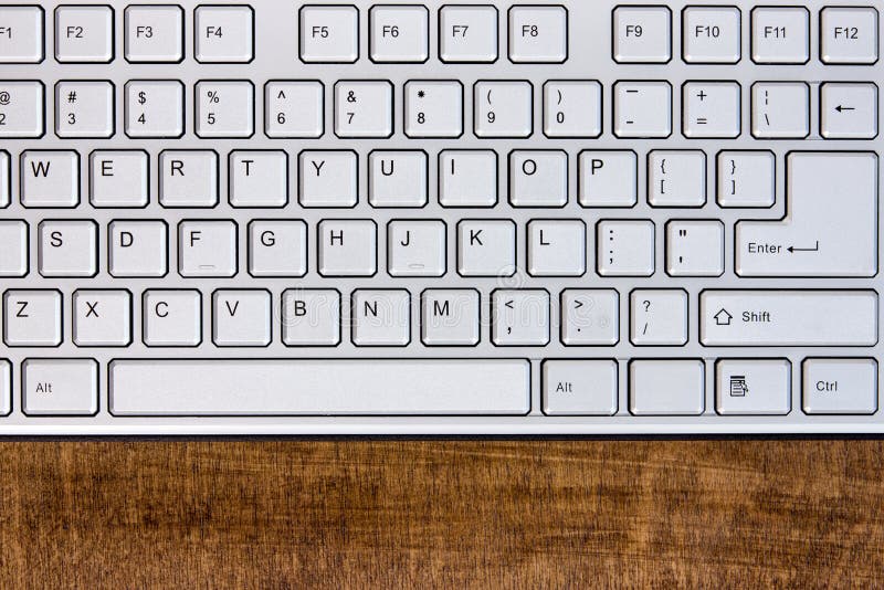 Keyboard on the Wooden Desk Stock Image - Image of device, desk: 33988409