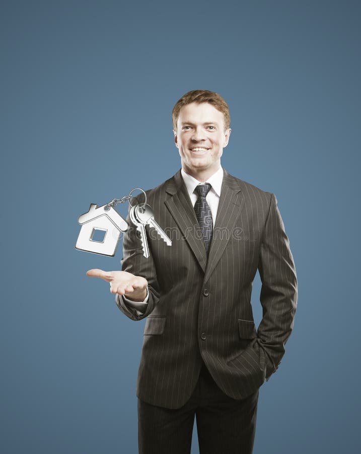 Keychain with key in hand stock photo. Image of boss - 27485226