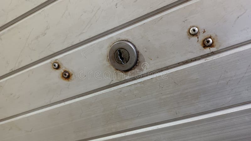 The Keyhole of a Closed Shop S Folding Door. Key Hole Stock Image ...