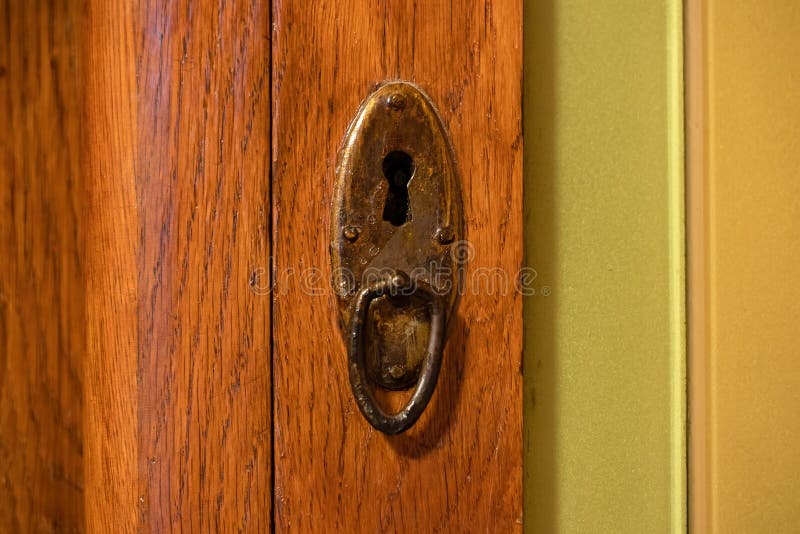 Keyhole and Door Handle of an Old Wooden Cabinet or Dressing Table ...